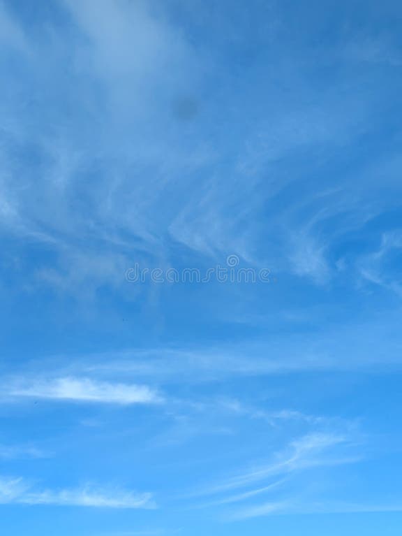 Big White Fluffy Clouds on a Blue Sky with Fine Whispy Lines Stock ...