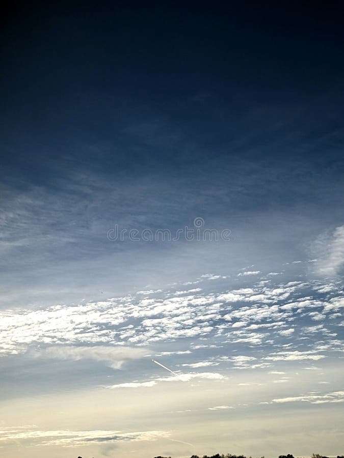 Big White Fluffy Clouds on a Blue Sky with Fine Whispy Lines Stock ...