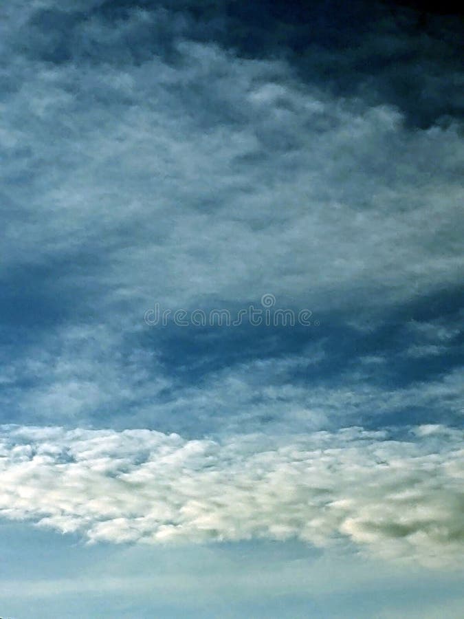 Big White Fluffy Clouds on a Blue Sky with Fine Whispy Lines Stock ...