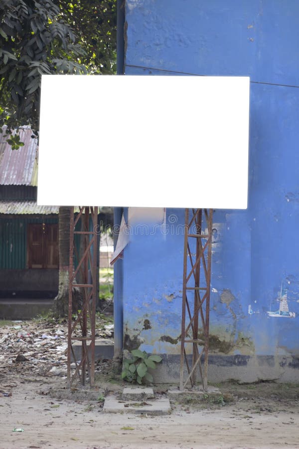 A Big White Signboard Attaches Two Iron Poles and the Background Blur ...