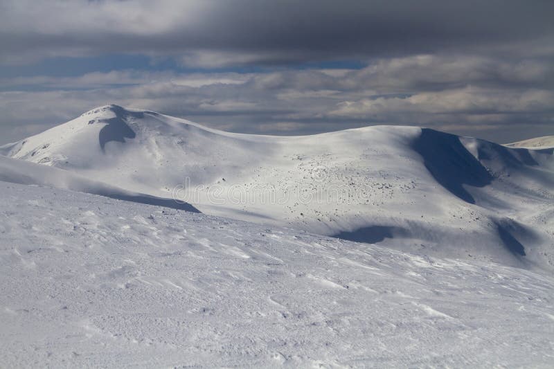 Big White Snow Fields and Blown Snow in High Mountains Stock Image ...