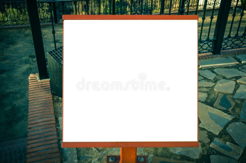 A Large White Square Sign with a Red Pole Next To it Stock Image ...