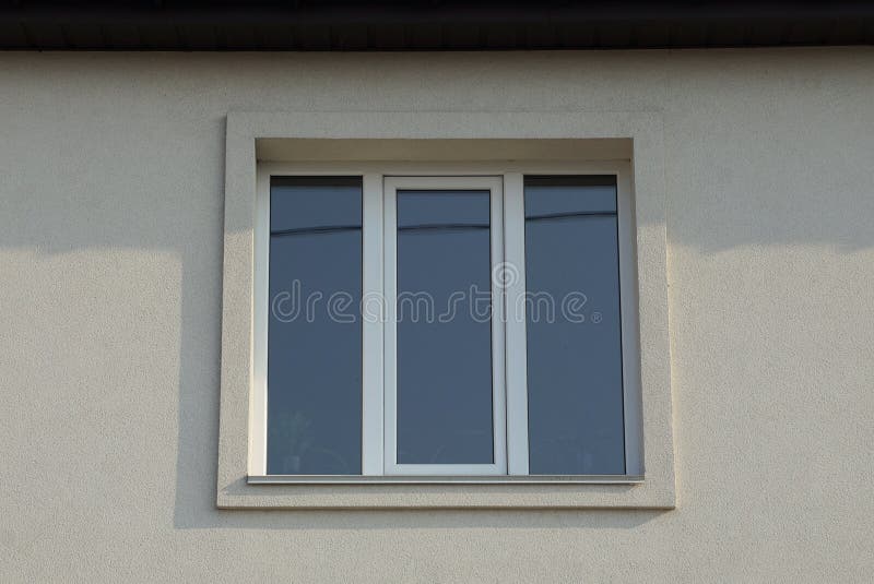 One Big Square Window Behind a Brown Iron Grating on the Wall Stock ...