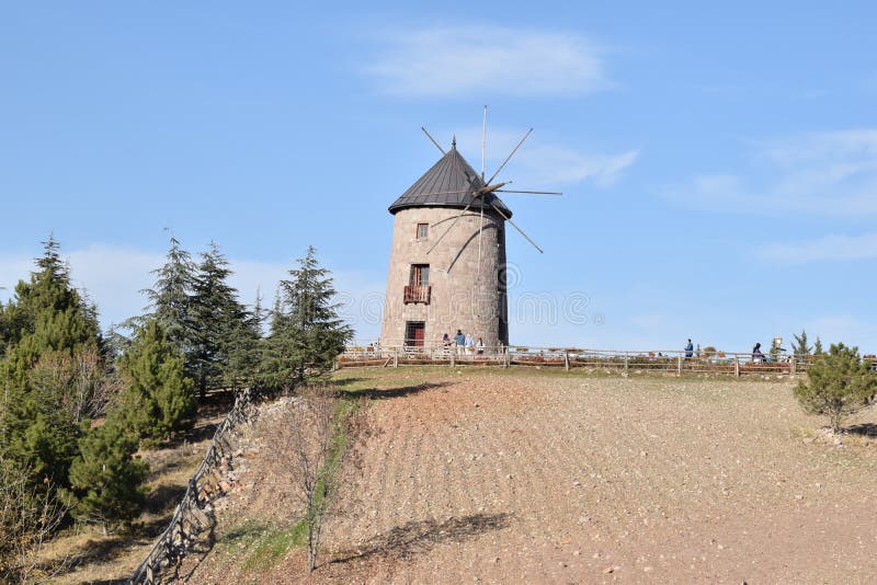 A big windmill in country stock image. Image of field - 261243969