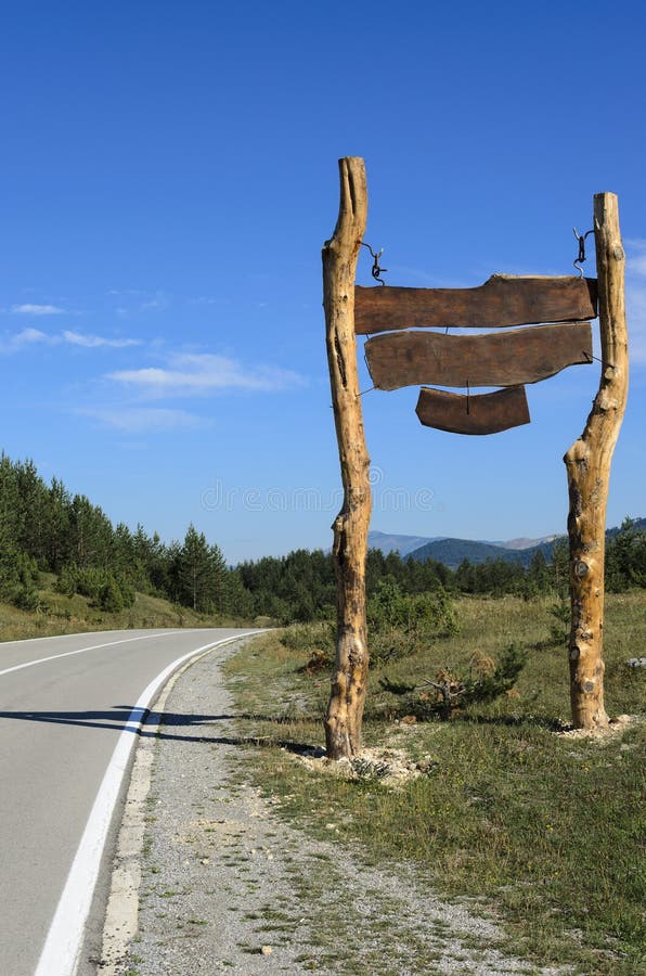 Big Wood Sign by the Road on the Mountain Stock Photo - Image of ...