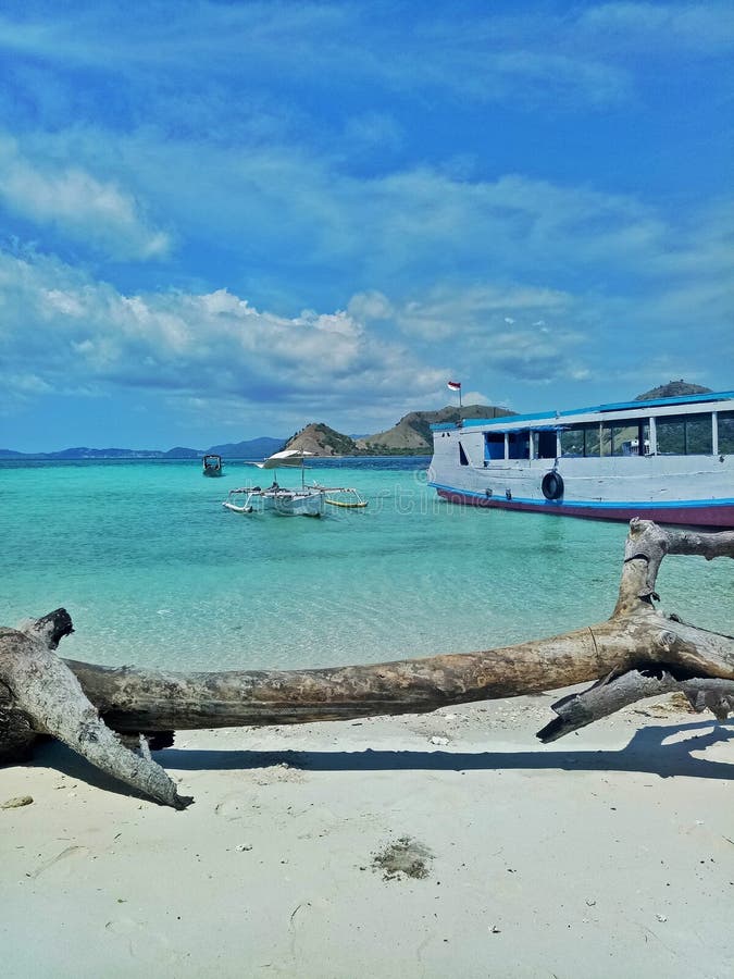 Big Wood and Some Boat on the Beach Stock Photo - Image of water, wave ...
