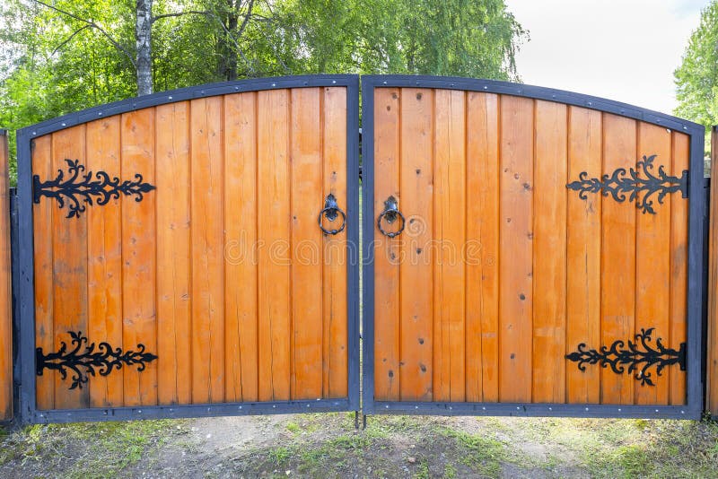 Big Wooden Gate with Metal Knobs and Door Hinges Stock Image - Image of ...