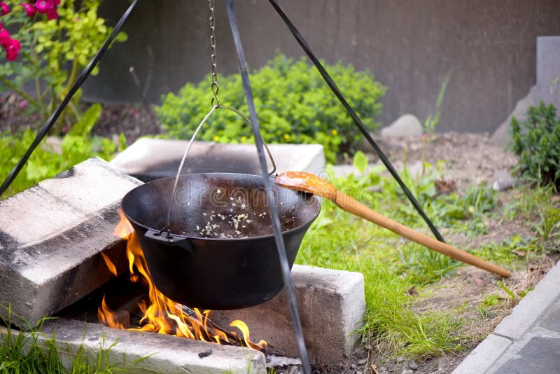 Big Wooden Spoon and a Cauldron on Fire Stock Photo - Image of wood ...