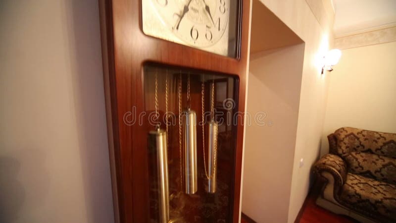 Big Wooden Wall Clock with Moving Pendulum in Stock Footage - Video of ...