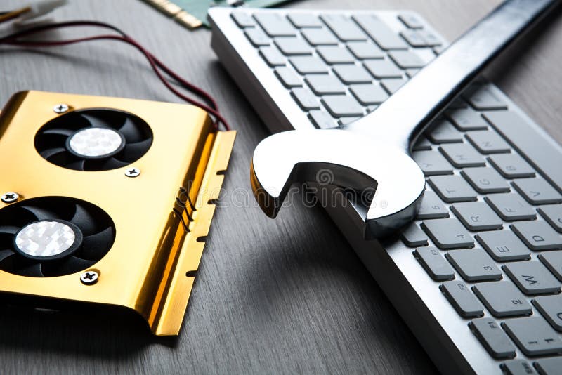 Big Wrench and a Computer Keyboard and Computer Parts Stock Photo ...