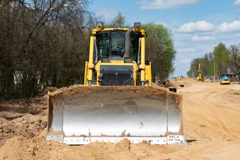 Bulldozer on a Road Construction Site Stock Photo - Image of bulldozer ...