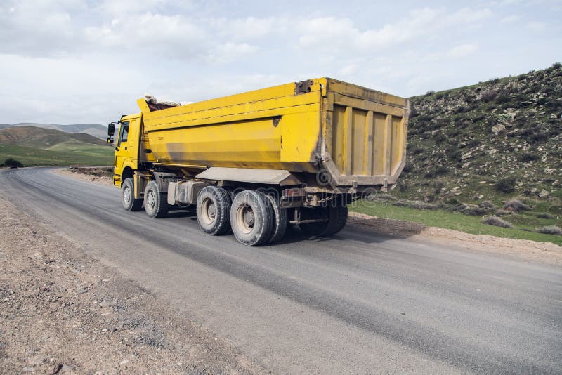 Big Yellow Dump Truck on the Highway Stock Photo - Image of transport ...