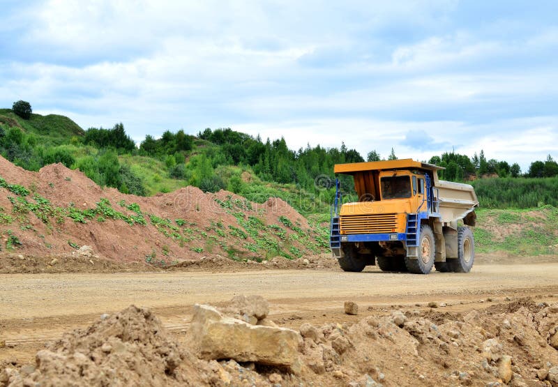 Big Yellow Dump Truck Working in the Limestone Open-pit. Stock Image ...