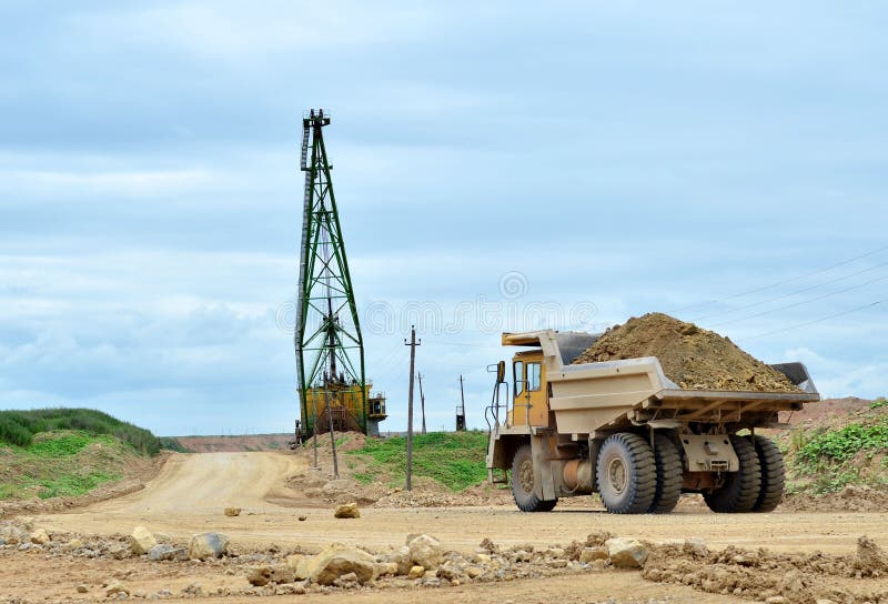 Big Yellow Dump Truck Working in the Limestone Open-pit. Stock Photo ...