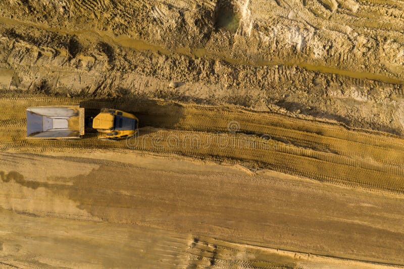 Yellow Excavator at a Road Construction Site Stock Photo - Image of ...