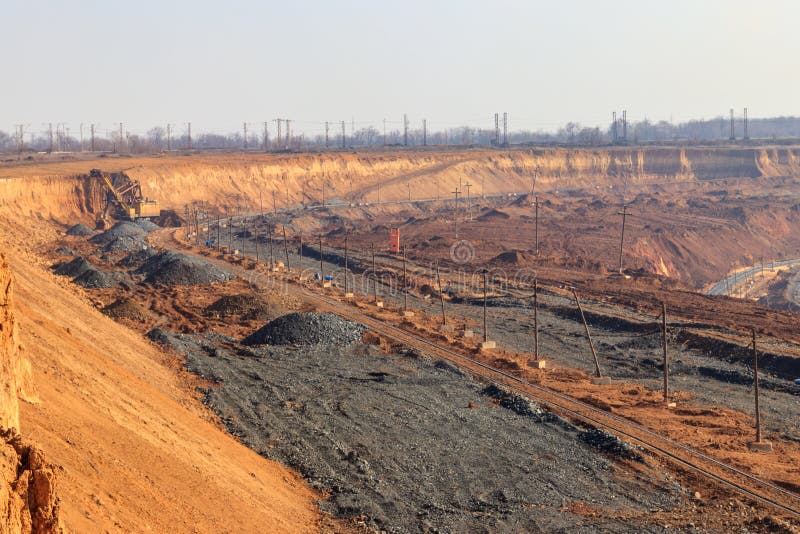 Big Yellow Excavator Working in Iron Ore Quarry Stock Image - Image of ...