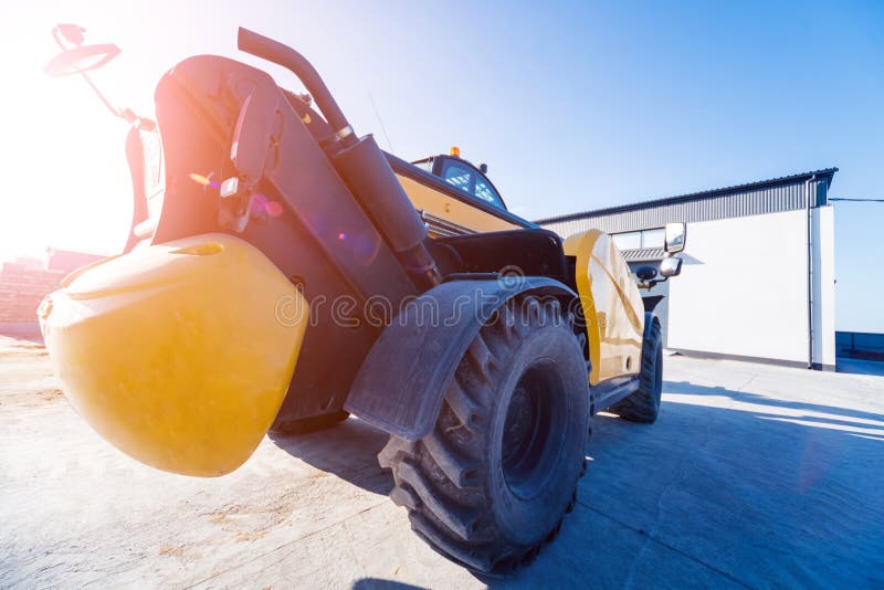 Big Yellow Forklift Loader Working Near Warehouse Stock Photo - Image ...