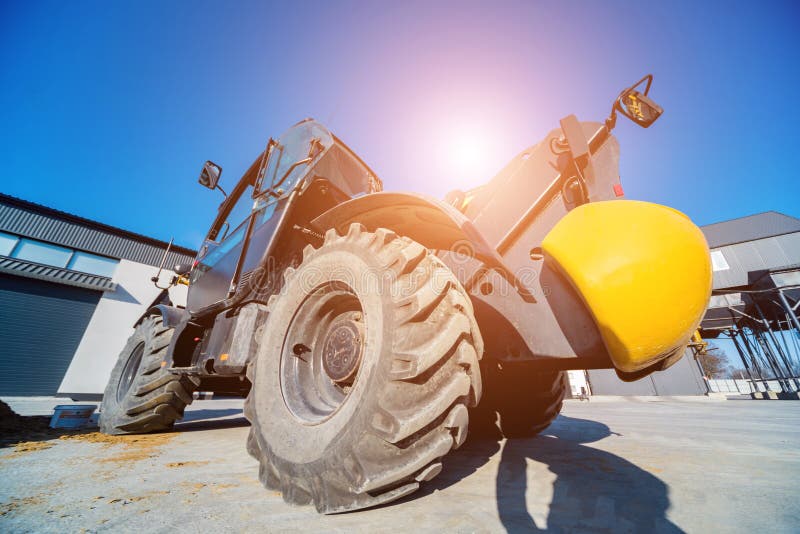 Big Yellow Forklift Loader Working Near Warehouse Stock Photo - Image ...
