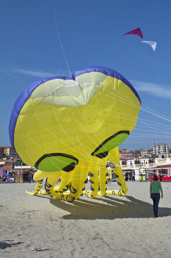 A Big Yellow Kite in the Blue Sky on the Beach Stock Image - Image of ...