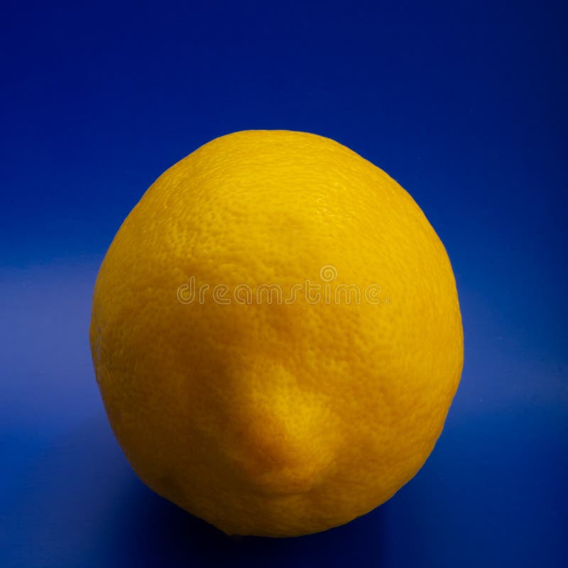 Big Yellow Lemon on a Blue Background. Stock Image - Image of food ...