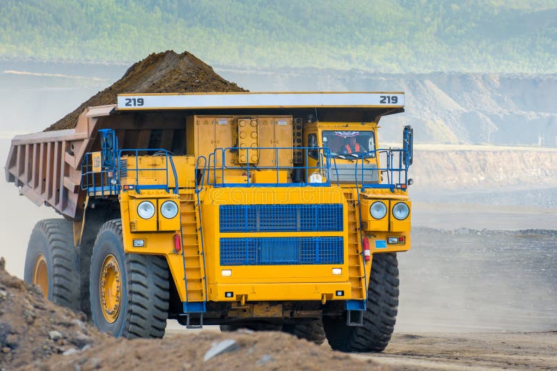 Big yellow mining truck editorial stock image. Image of ground - 73830284
