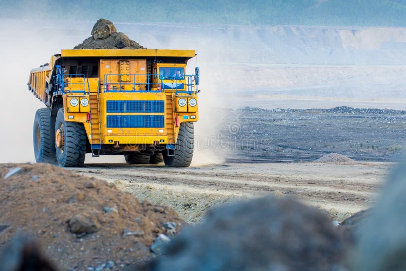 Big yellow mining truck editorial image. Image of loaded - 73830350