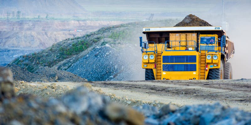 Big yellow mining truck editorial photography. Image of huge - 73830362