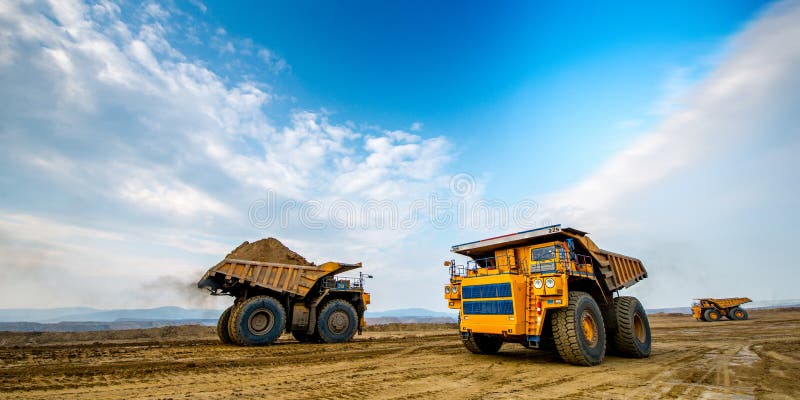 Yellow mining trucks stock image. Image of equipment, gold - 8176025