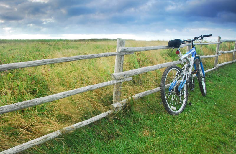 Bike Against Fence stock image. Image of bicycle, clouds - 1541869