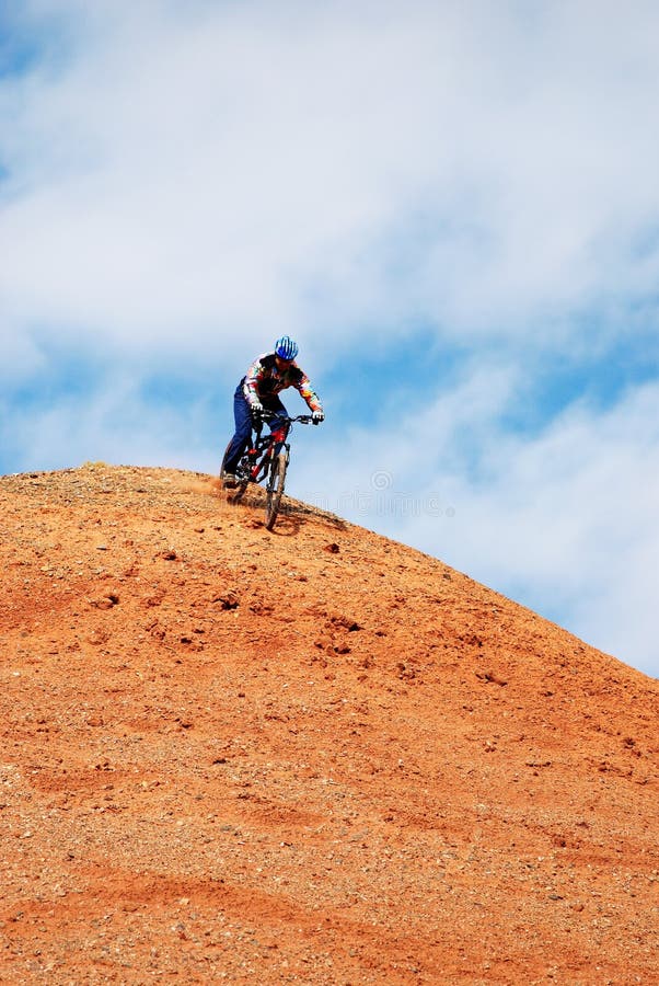 Bike Downhill on red hill stock image. Image of downhill - 3560579