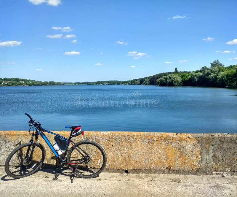 Bike on the Old Concrete Bridge Over the Wide River Stock Photo - Image ...