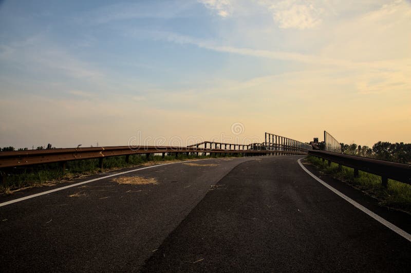 Bike Path in the Countryside with a Cloudy Sky at Sunset in Summer ...