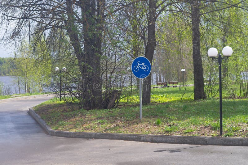 Bike Path in the Park, a Blue Road Sign with a Cyclist is Installed ...