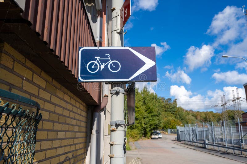 Bike Path Sign on a Pole by a Building.. Stock Photo - Image of green ...