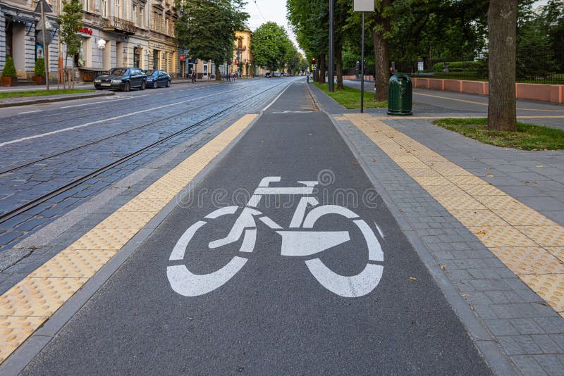 Bike path sign on the road stock photo. Image of environment - 284679264