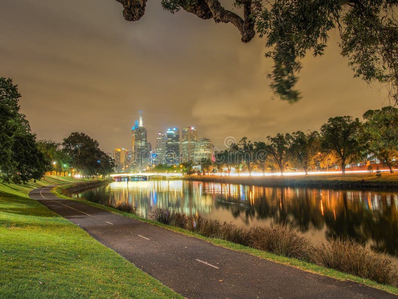 Bike path to the city stock image. Image of night, skyscrapers - 94583823