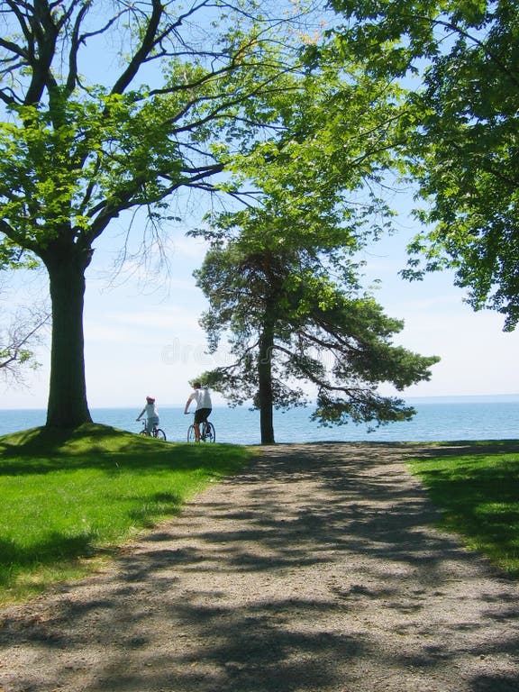 Bike path to lake stock image. Image of daughter, park - 664381