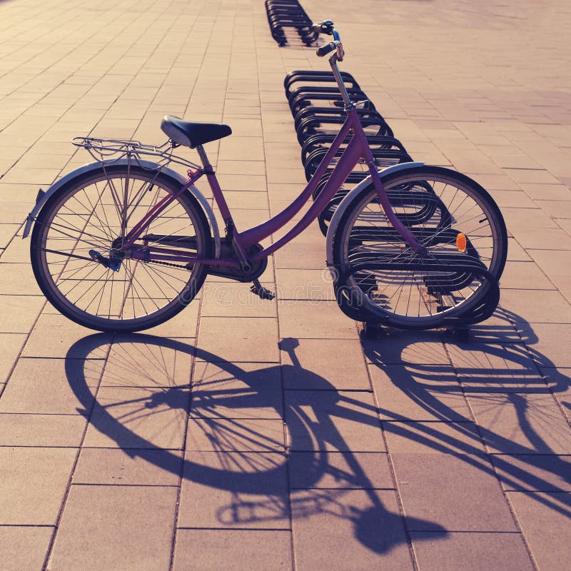 Bike Shadow on Parking at Sunset in the Evening Stock Image - Image of ...