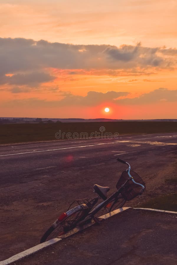 Bicycle Parked Near the Road at Sunset. Stock Image - Image of bicycle ...