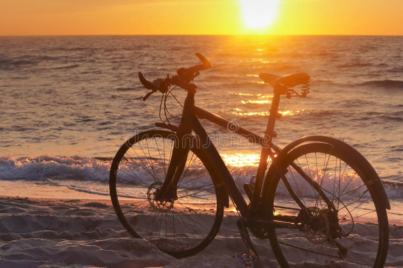 Bike and Sunset by the Sea, Black Bike by the Sea Stock Image - Image ...