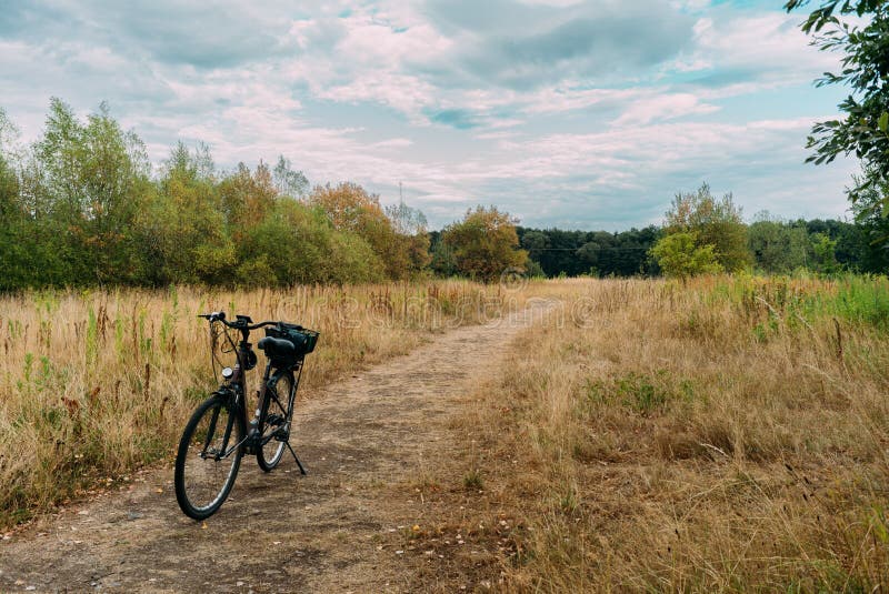 Bike on a Trail in a Yellow Field Editorial Stock Photo - Image of ...