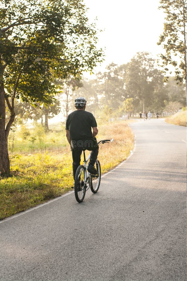Biker Biking in the Morning Editorial Stock Image - Image of lake ...