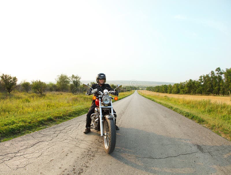 Biker on the country road stock image. Image of motorcyclist - 28660637