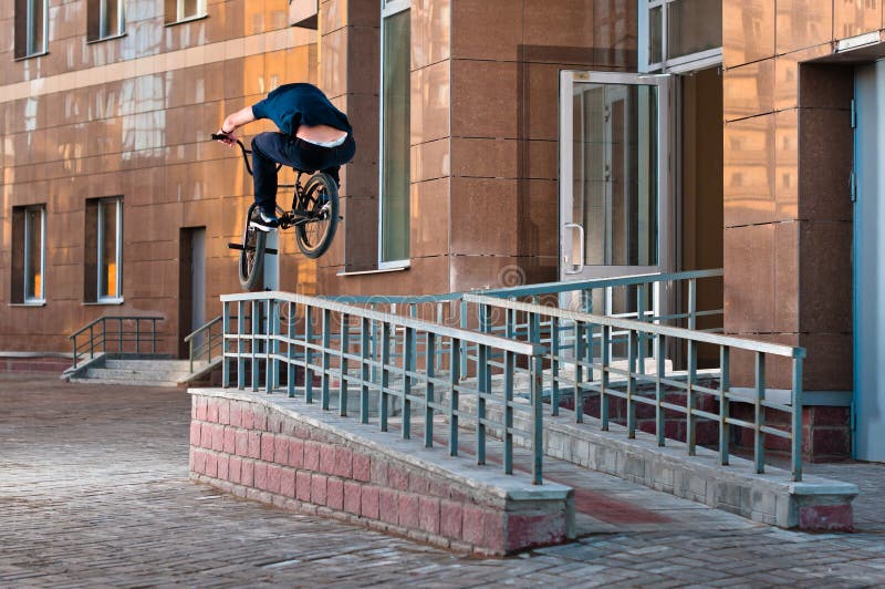 Biker Doing Rail Hop Trick Back View Stock Image - Image of excitement ...