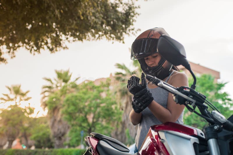Biker Girl Getting Ready To Go Out with Her Motorcycle Stock Image ...