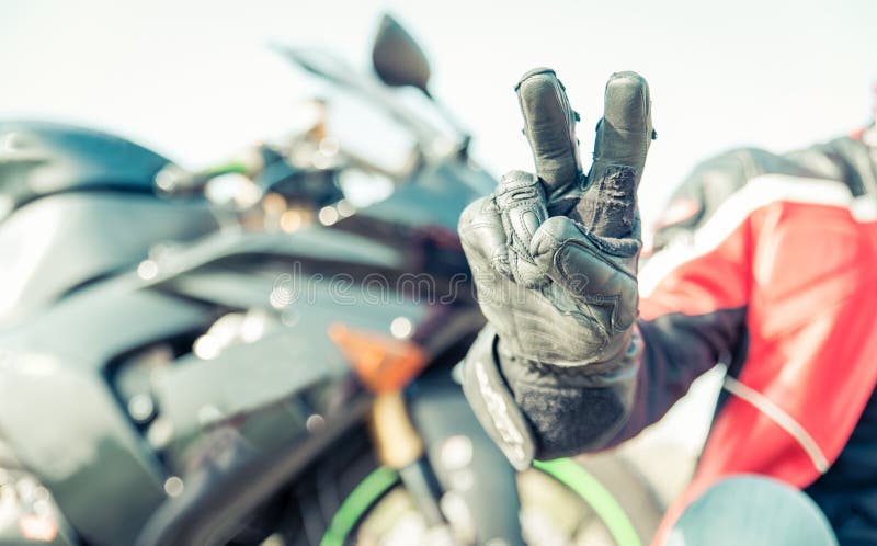Biker greeting n the road. stock image. Image of powerful - 55768101