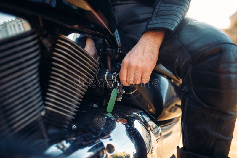 Biker Inserts the Key in the Ignition of Chopper Stock Photo - Image of ...