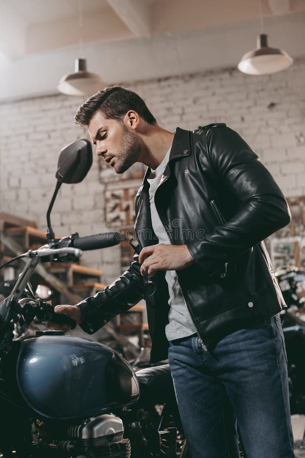 Young Handsome Biker in Black Leather Jacket with Classic Motorcycle ...