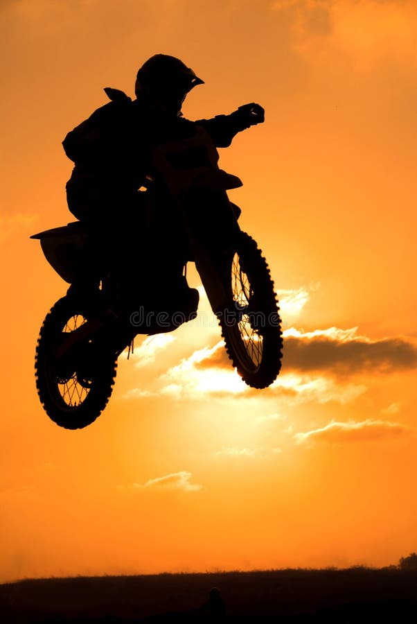 Jumping motorcycle rider stock photo. Image of beautiful - 34207536