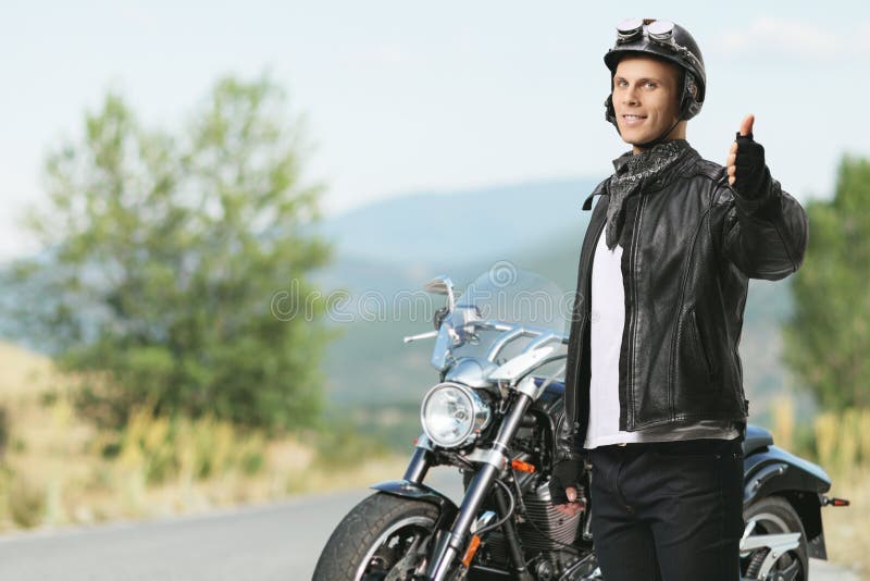 Biker Making a Thumb Up Gesture Stock Photo - Image of finger, bike ...